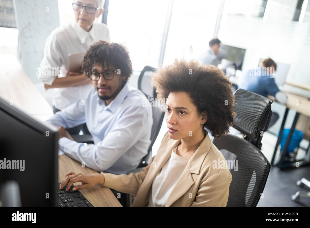 Successful business group of people at work in office Stock Photo - Alamy