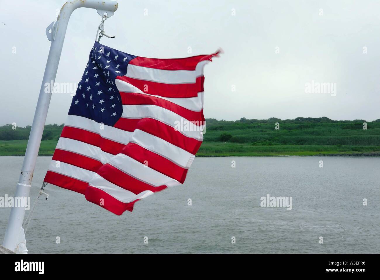 Cape May-Lewes Ferry - Flag on aft deck Stock Photo - Alamy