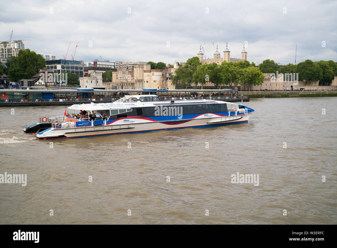 Thames Clippers sailing near The tower of London on the river Thames ...
