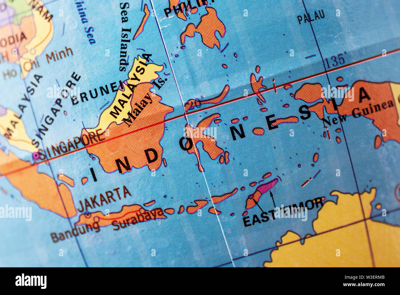 Focus to the islands of Indonesia on a world globe with colorful ...