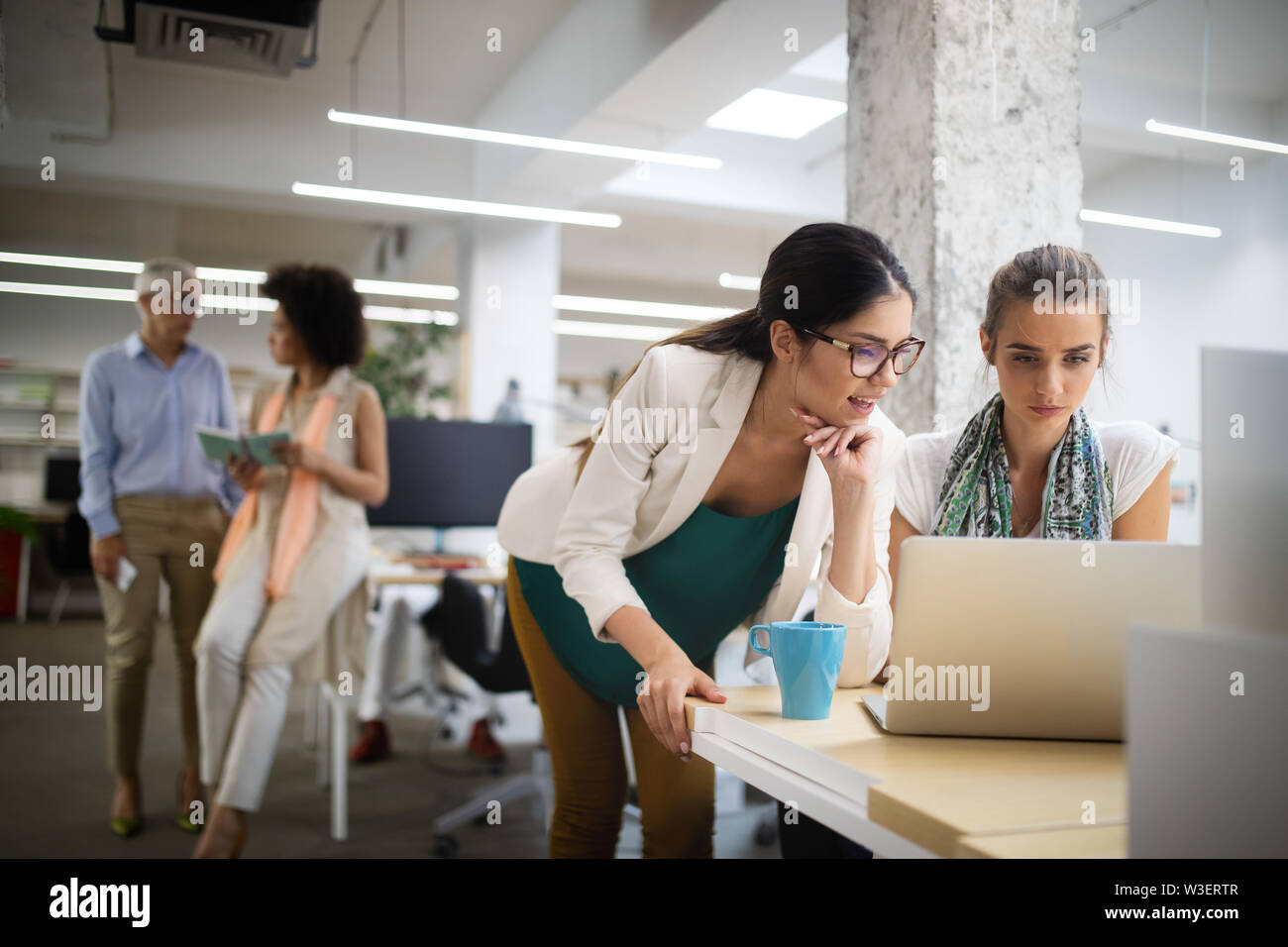 Programmer working in a software developing company office Stock Photo ...