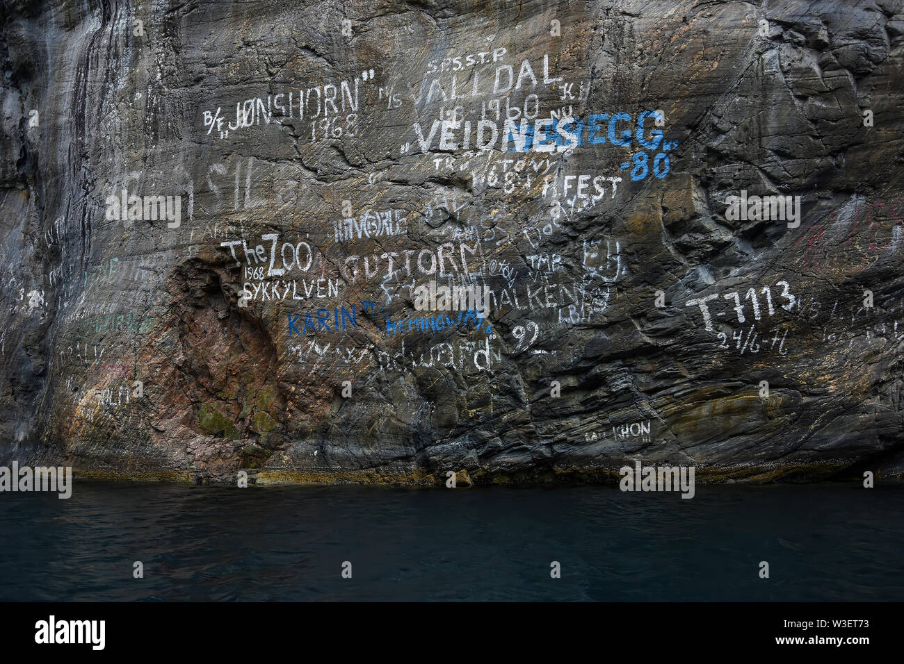 Signs on the rocks of Geiranger fiord coast, stunning natural ...
