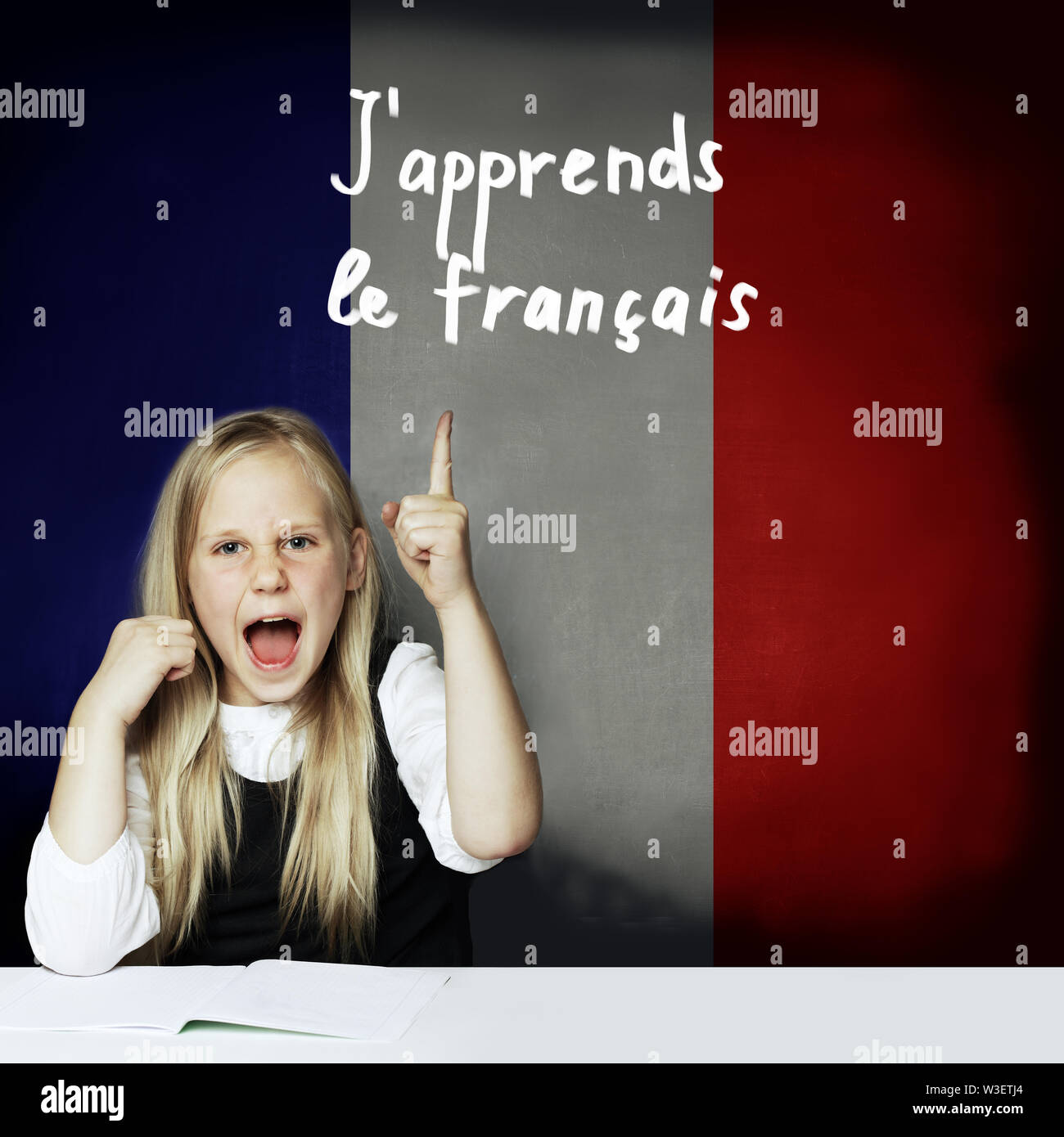 Learn french language concept. Happy child girl student pointing up on ...