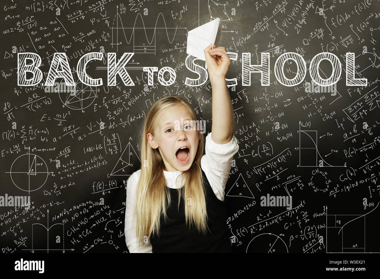 girl Student happy with plane on math chalkboard. Back to school background. Concept search ...