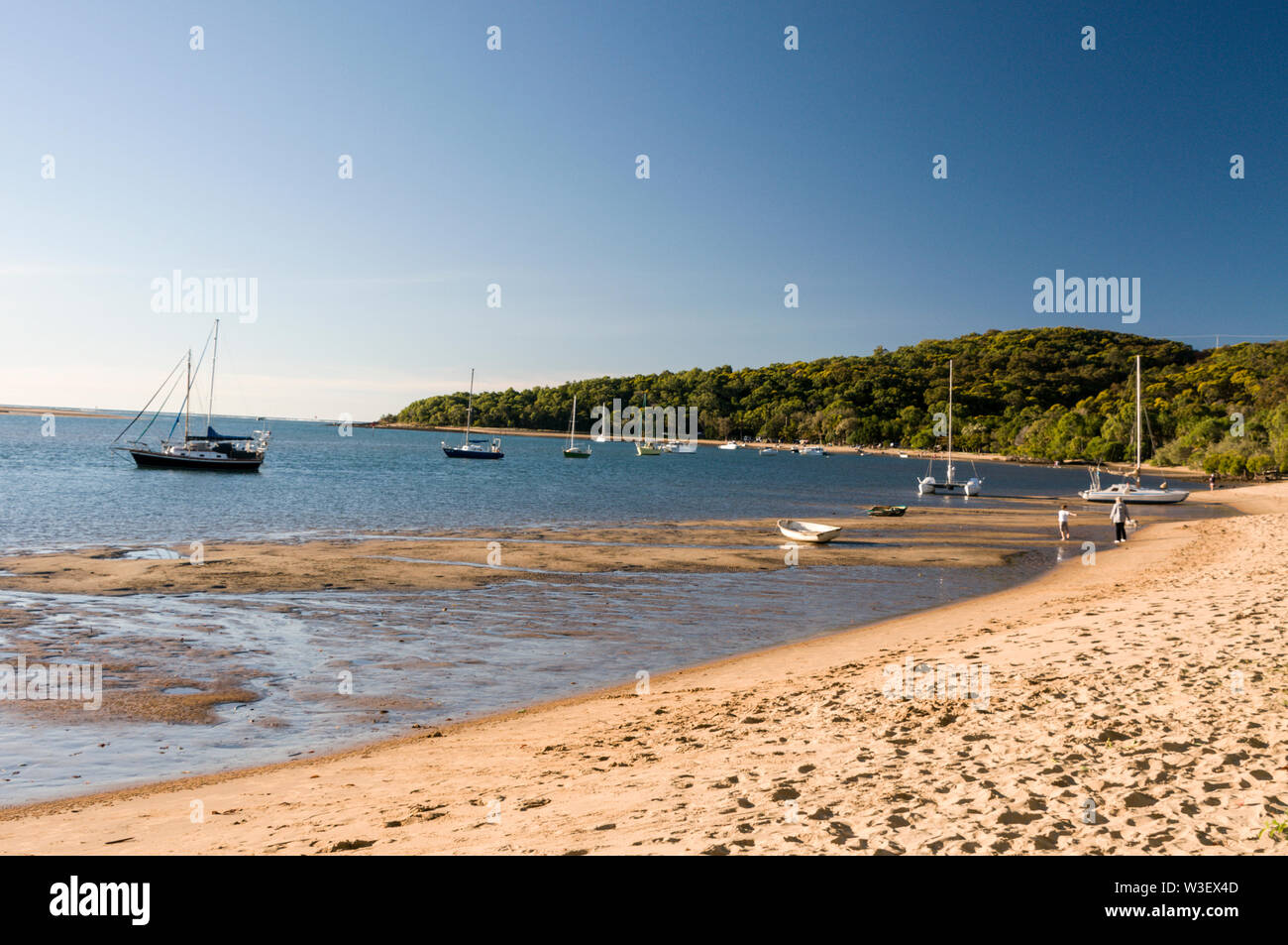 Ocean-going yachts moored Bustard Bay close to a small coastal town ...