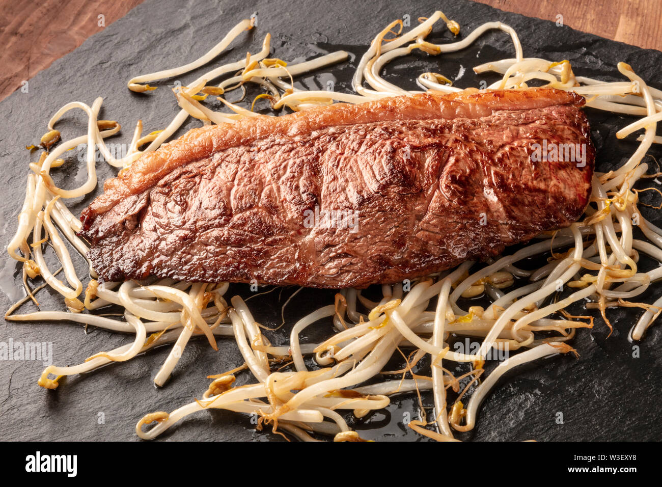 Kobe meat, wagyu beef steak, cooked, with soy sprouts Stock Photo - Alamy