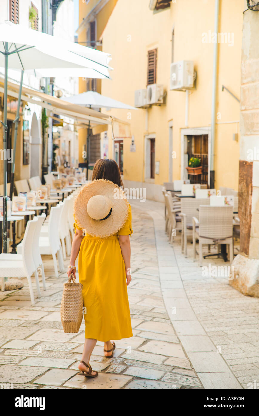 Woman walking between restaurant tables hi-res stock photography and ...