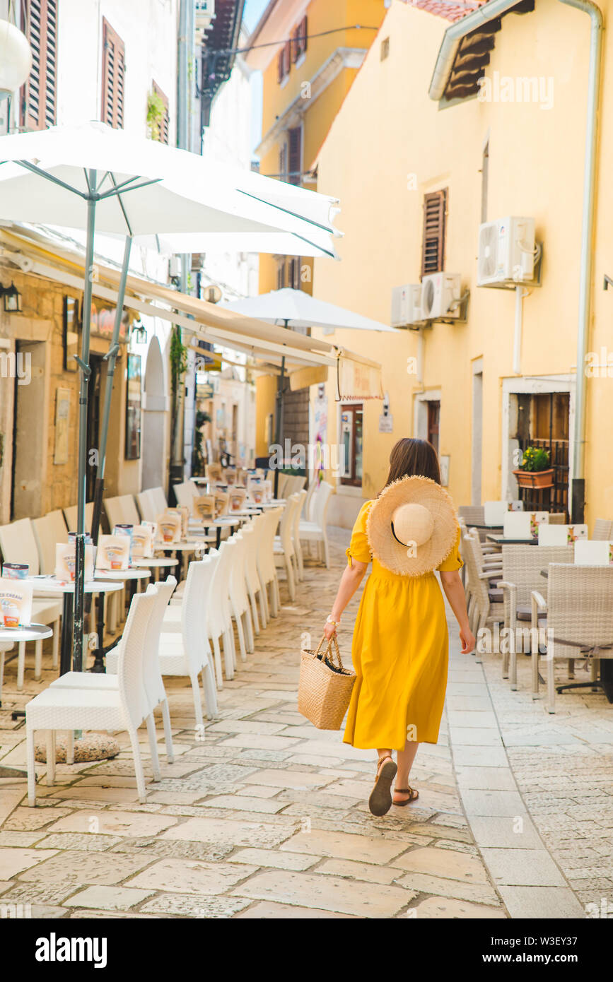 Woman walking between restaurant tables hi-res stock photography and ...