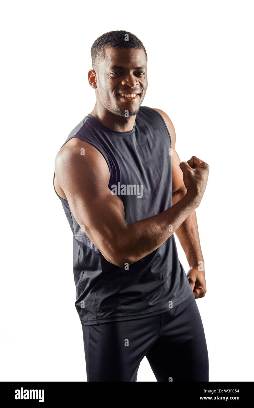 African cheerful happy strong man showing his muscles, isolated white ...