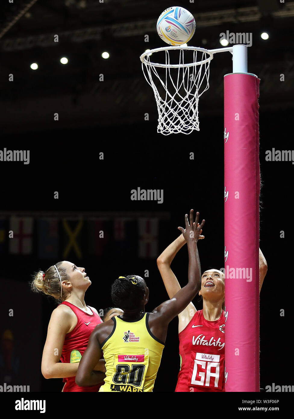 England's Helen Housby (right) takes a shot during the Netball World ...