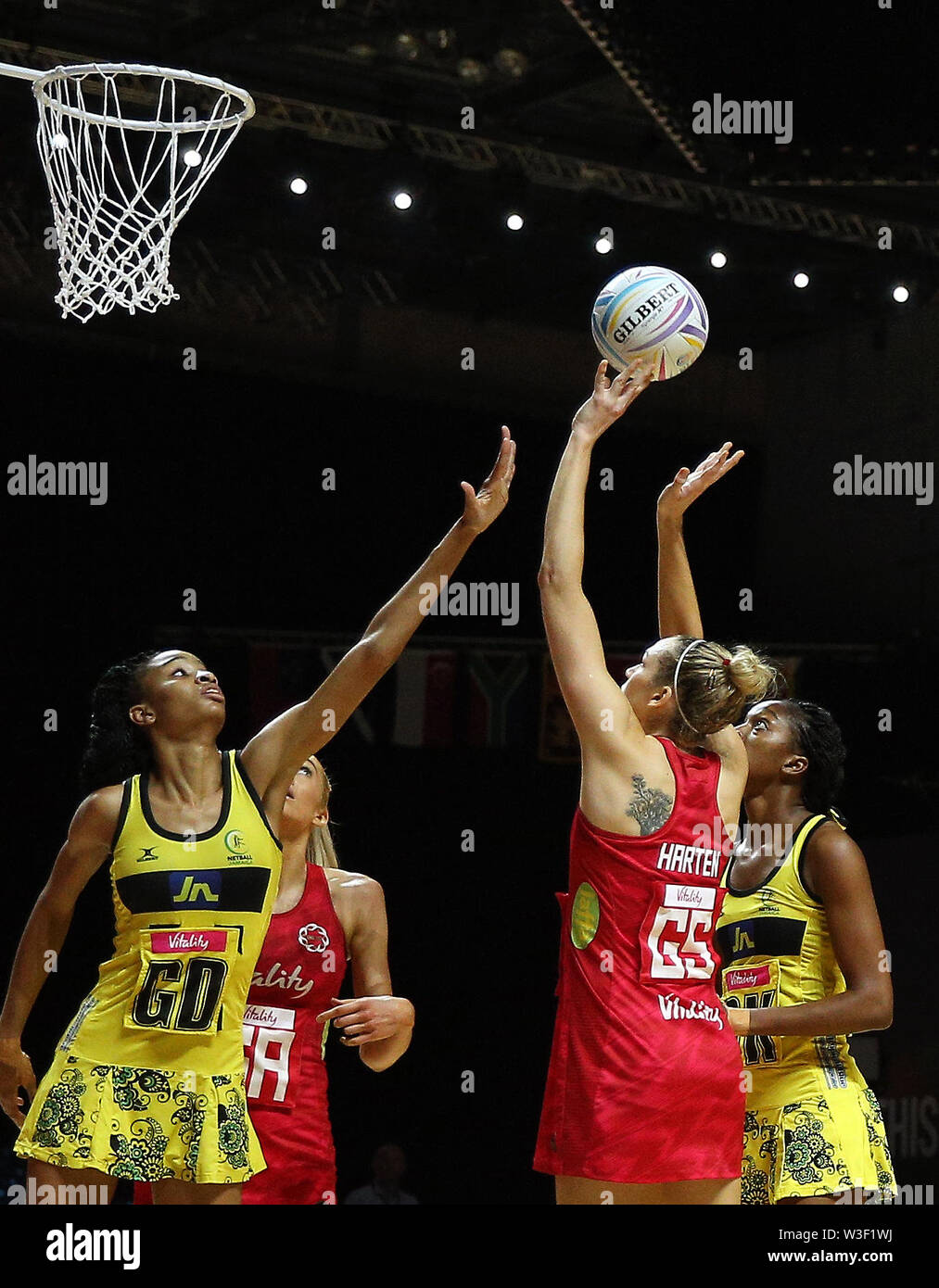 England's Joanne Harten (centre) attempts to make a shot during the ...