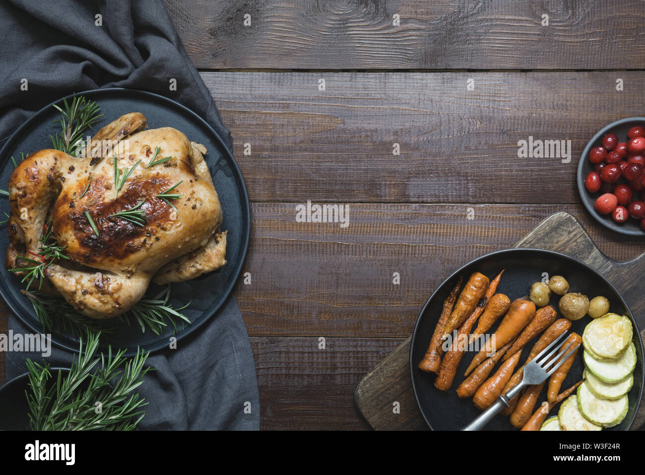 Traditional roasted turkey garnish vegetables and rosemary on dark ...