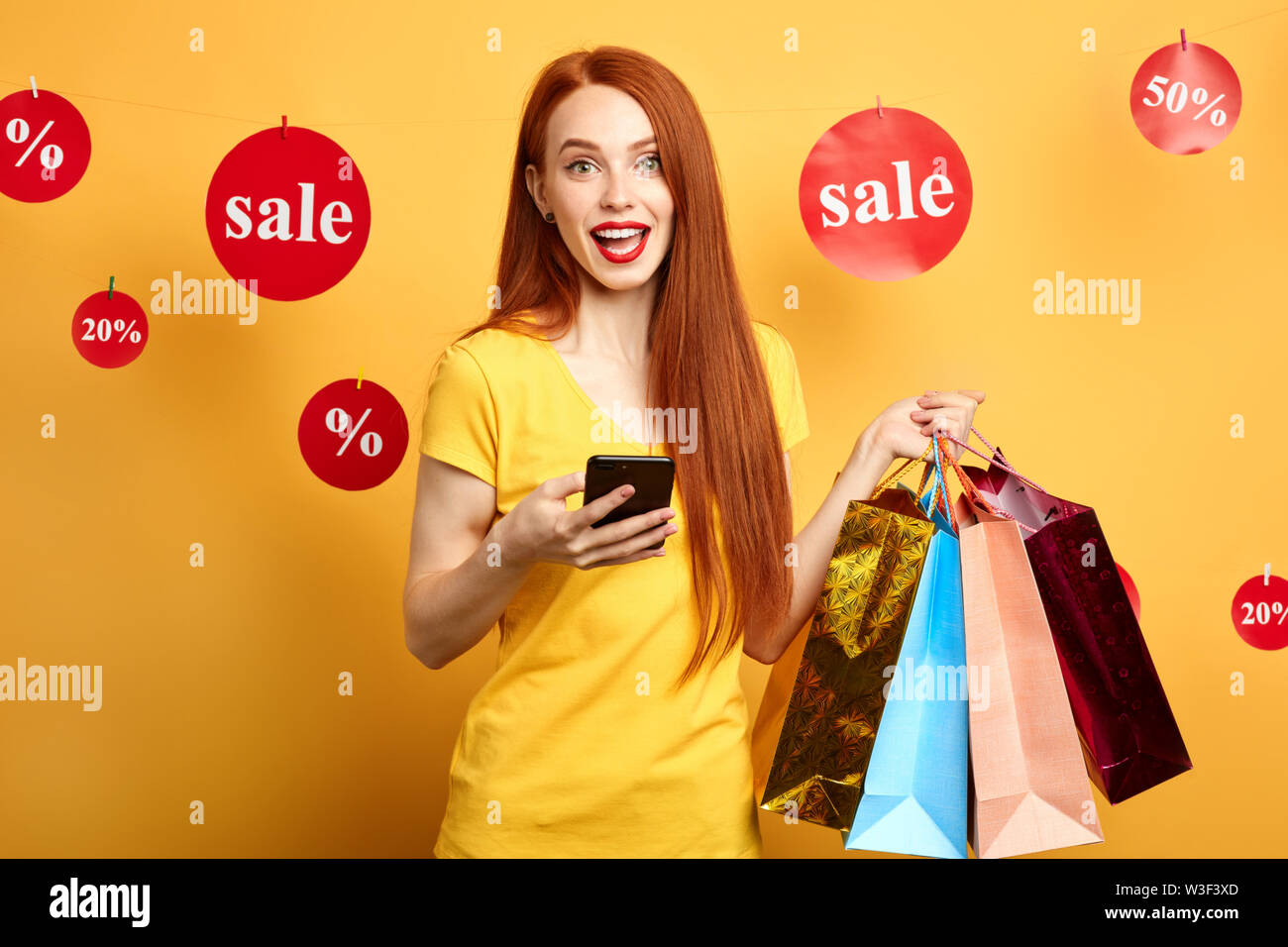 happy positive girl texting message, sms to her friend about big sale ...