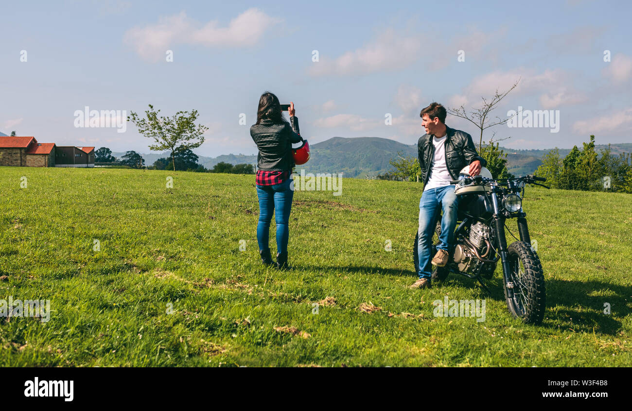 Couple making a landscape photo during a motorcycle trip Stock Photo ...