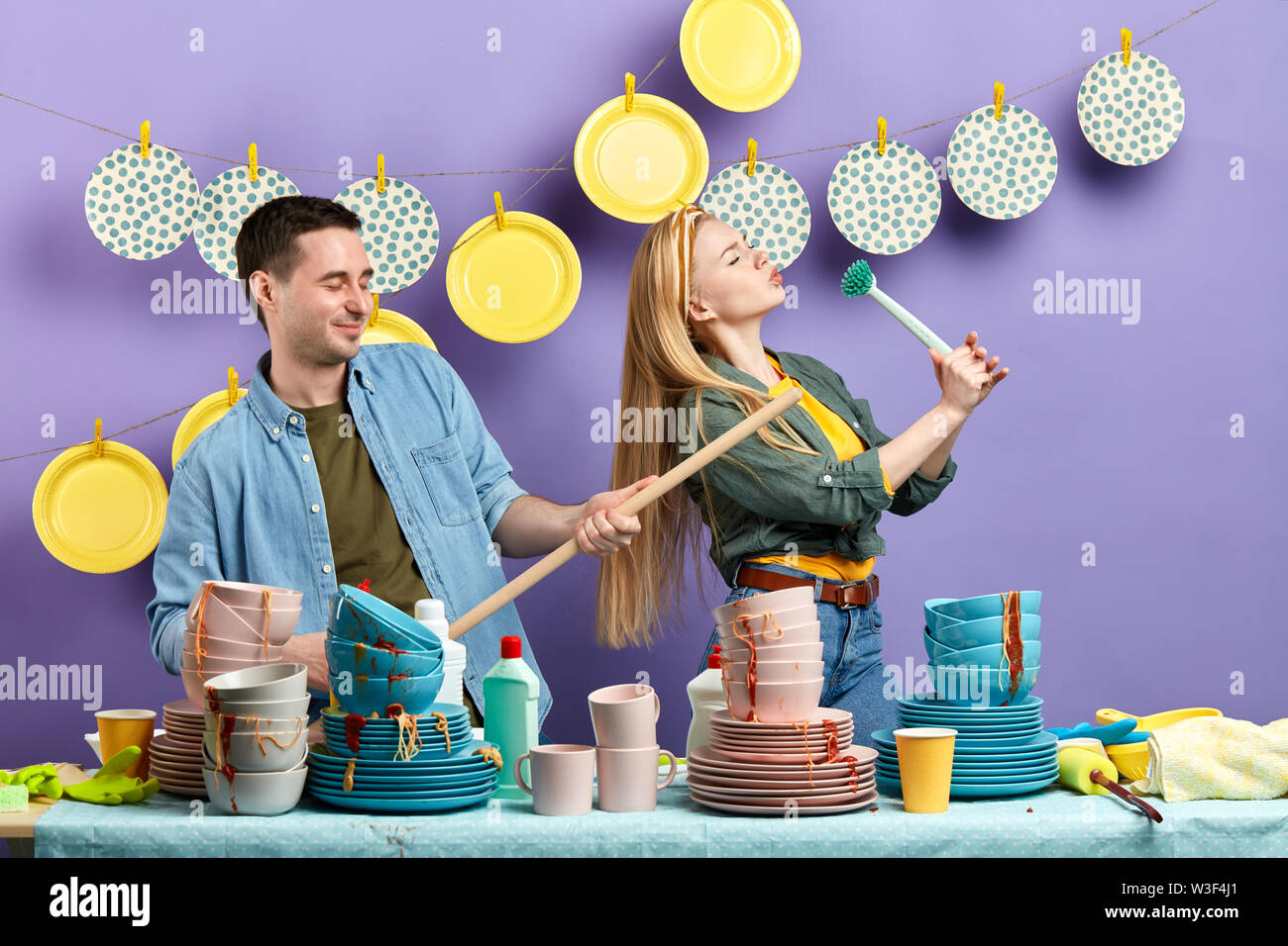 Boy washing plates hi-res stock photography and images - Alamy