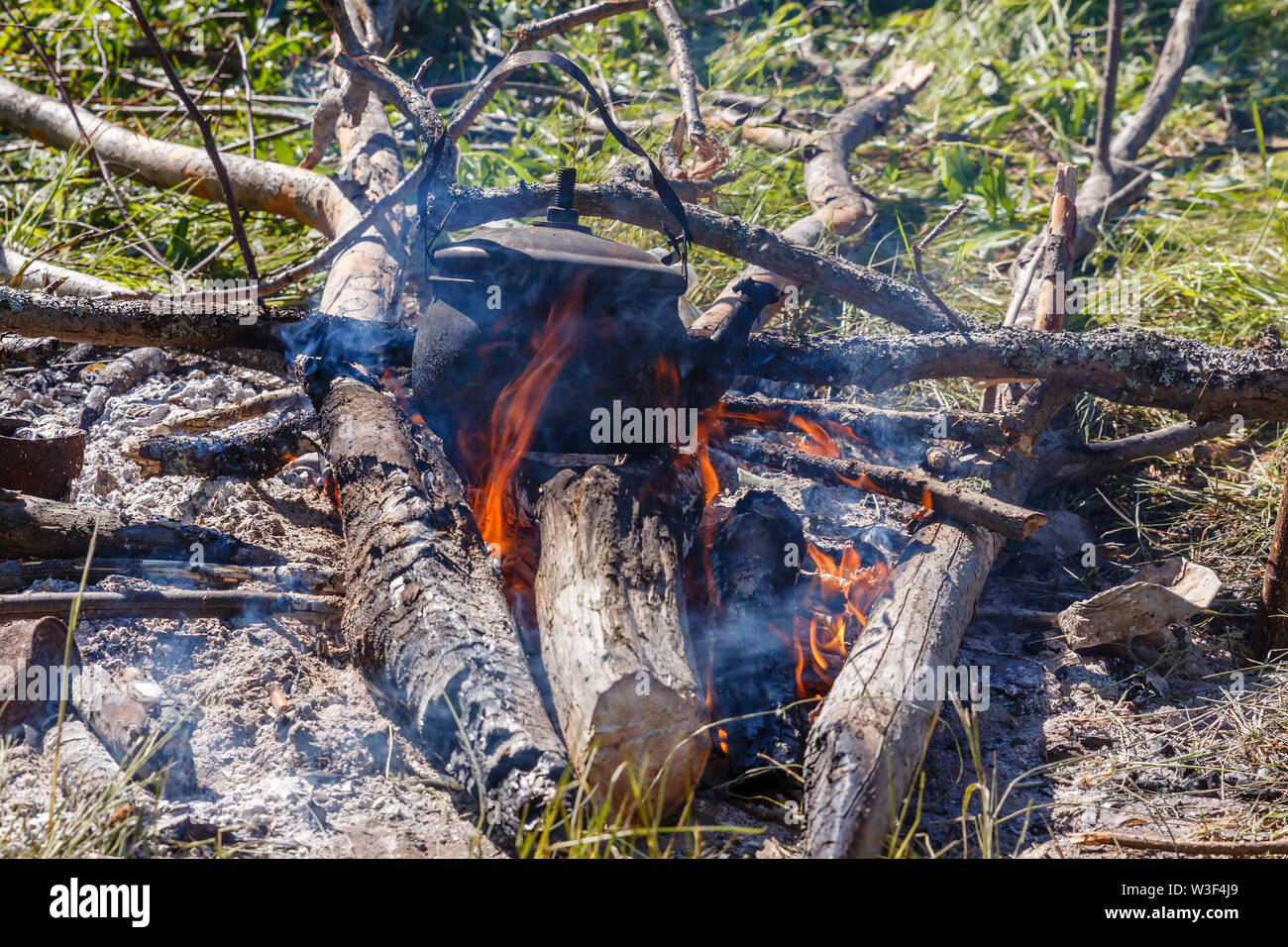 teapot on the fire, Boiling water with a kettle on the fire at an ...