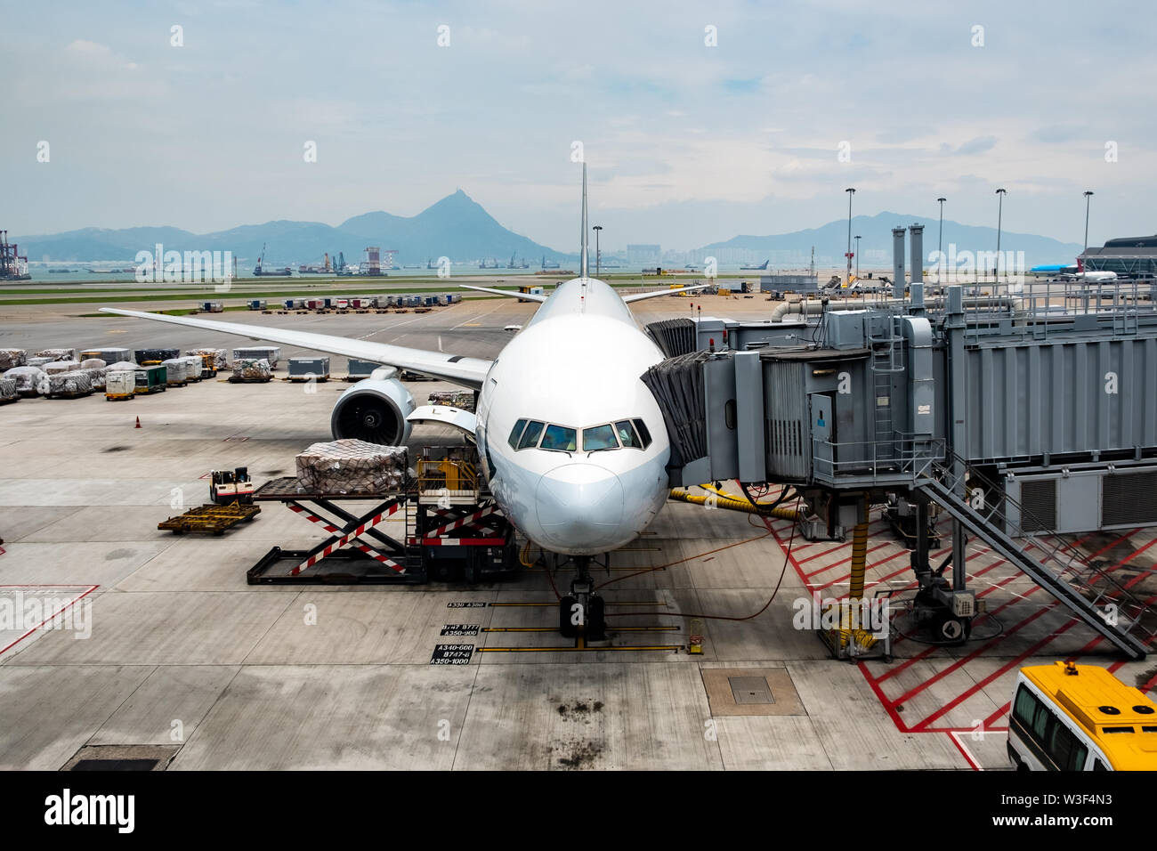 Lantau, Hong Kong - August 26, 2018 : Airplane dock with passenger ...