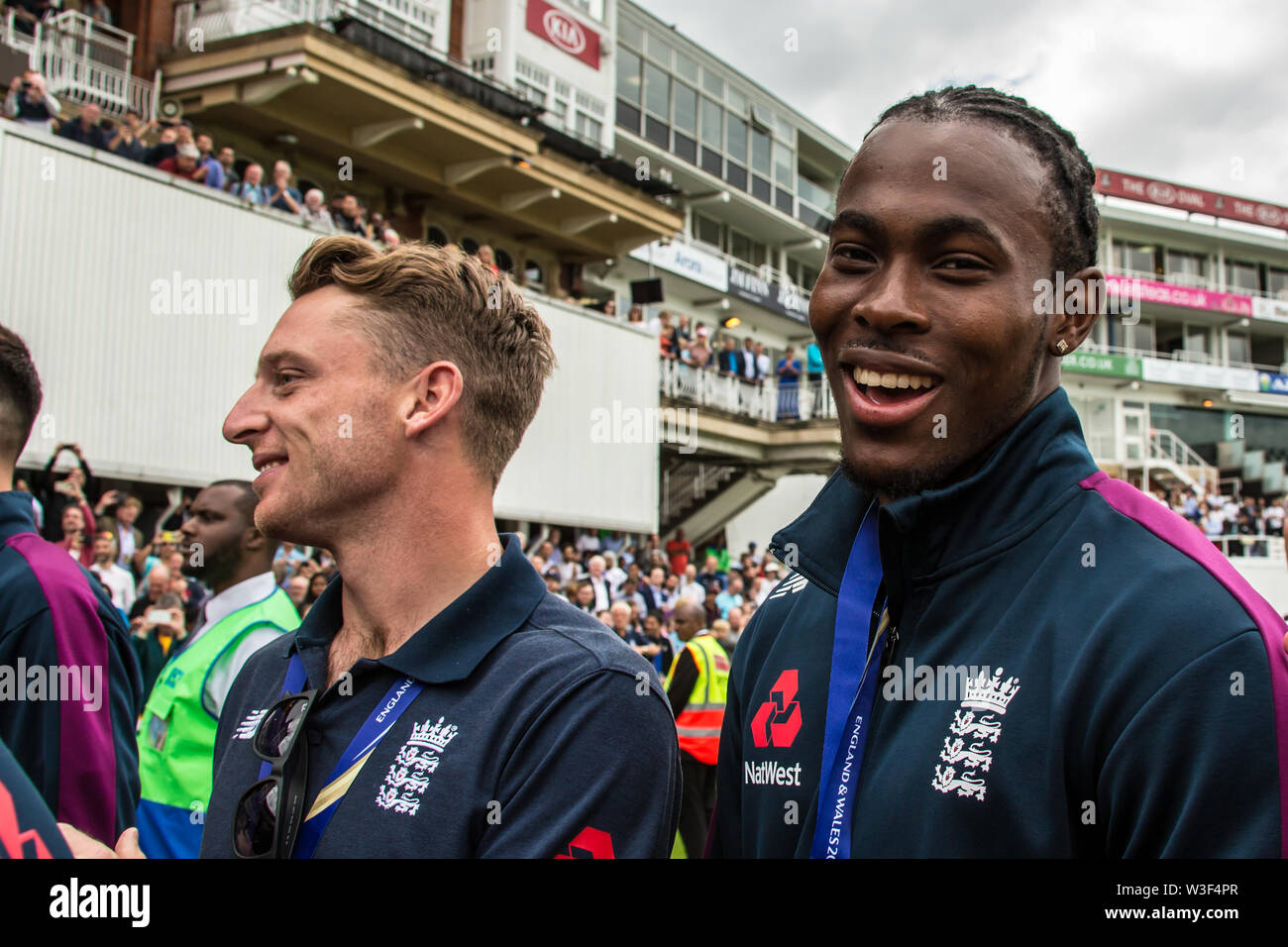 London, UK. 15 July, 2019. Jos Butler and Jofra Archer as England’s ...