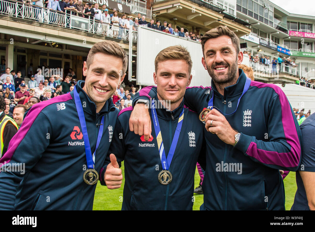 London, UK. 15 July, 2019. Chris Woakes, Jason Roy, Liam Plunkett as ...