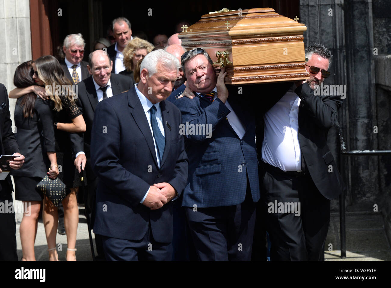 The coffin of Father Ted star Brendan Grace is carried out of the ...