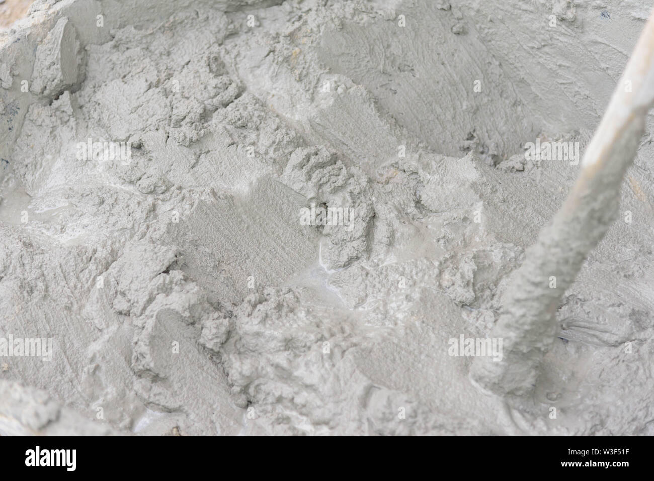 mixing the cement on tray for plaster the building Stock Photo - Alamy