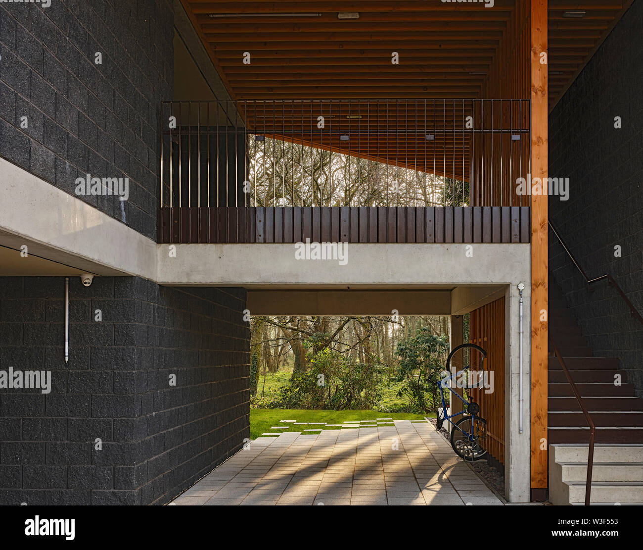 Wooden canopy of ground and first floor entrances. Staff Residences at ...