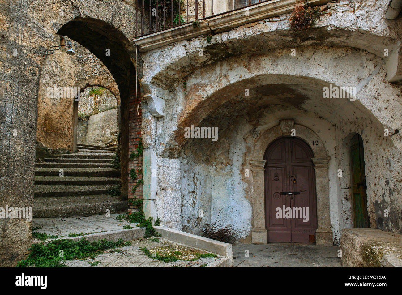 Medieval glimpse of alleys and stairways with access arches in the old ...