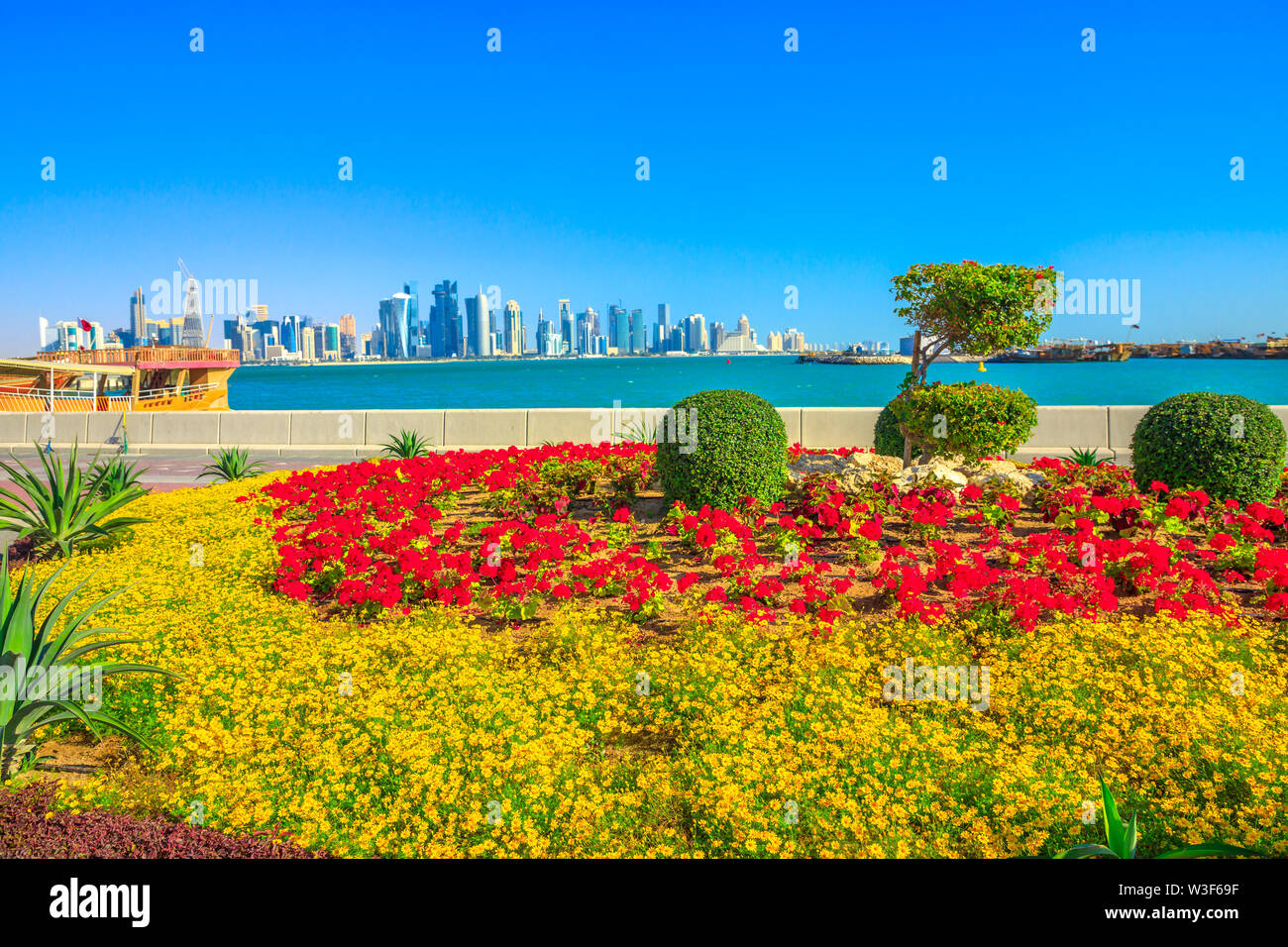 Spring landscape of flower beds and blooming trees on Corniche ...