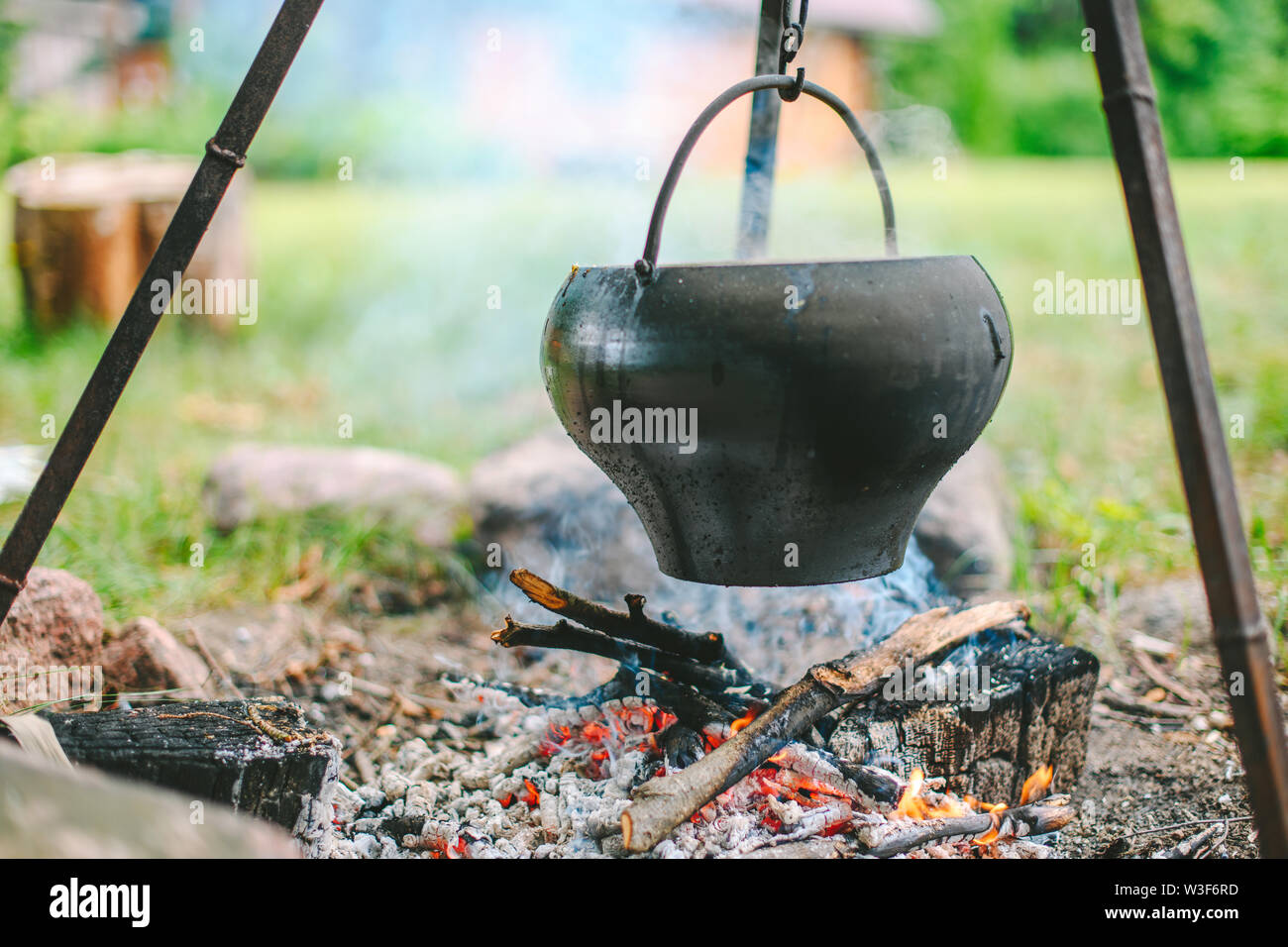 Cooking cabbage soup on a bonfire Stock Photo - Alamy