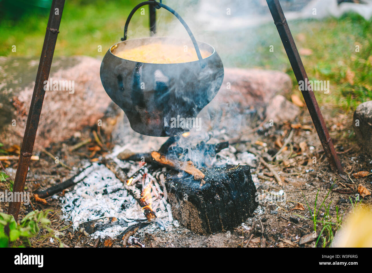 Cooking cabbage soup on a bonfire Stock Photo - Alamy