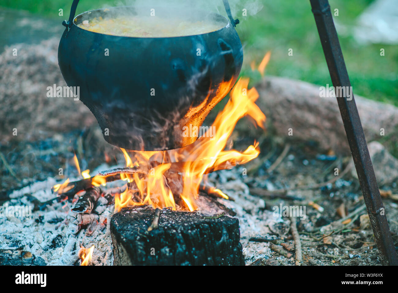 Cooking cabbage soup on a bonfire Stock Photo - Alamy