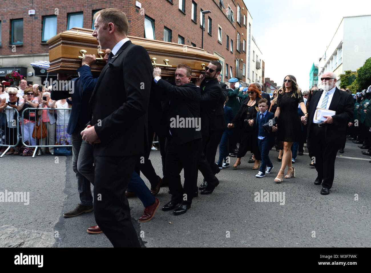 The coffin of Father Ted star Brendan Grace is carried into the Church ...