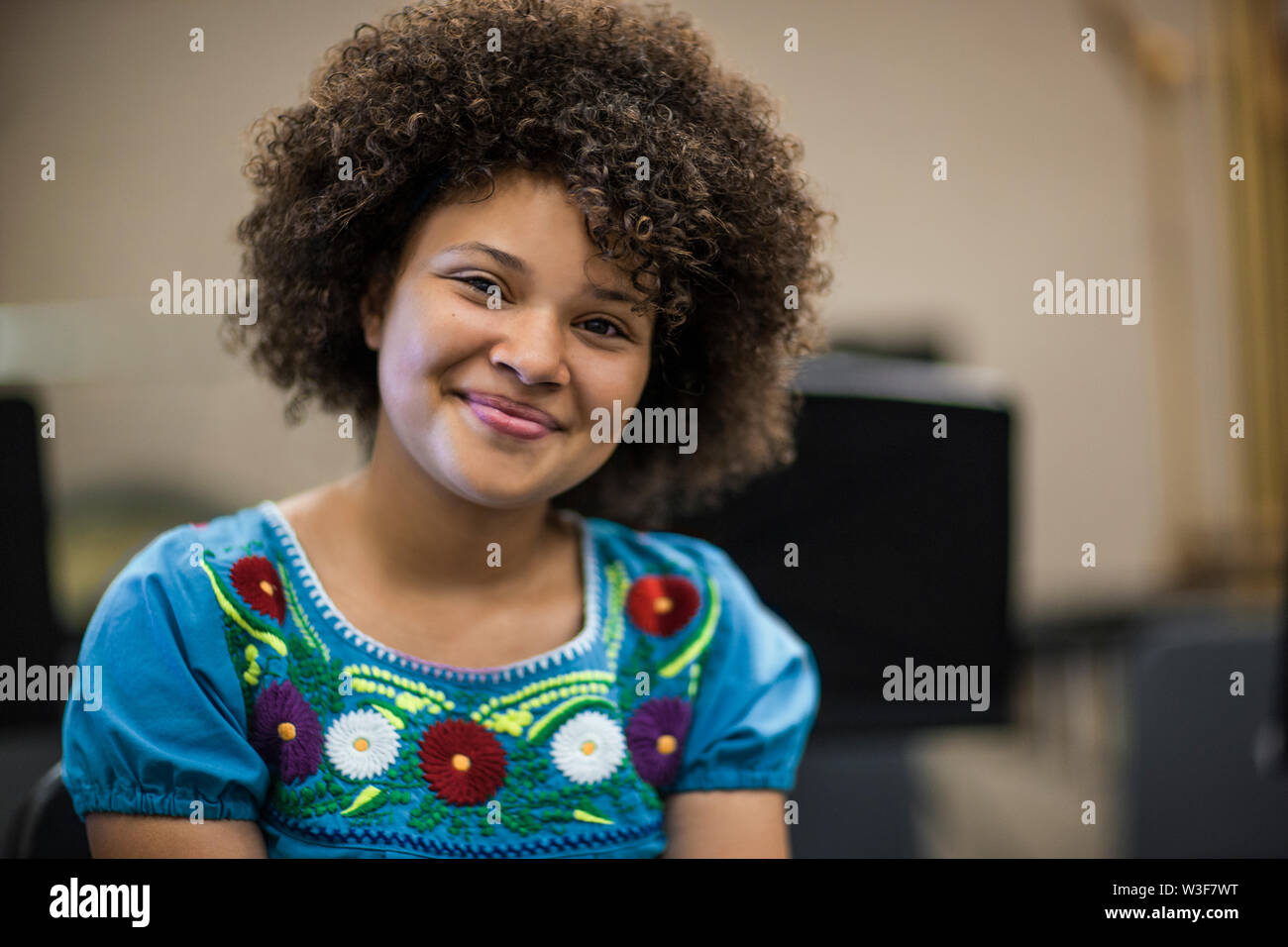 Portrait of teenage girl smiling at school Stock Photo - Alamy