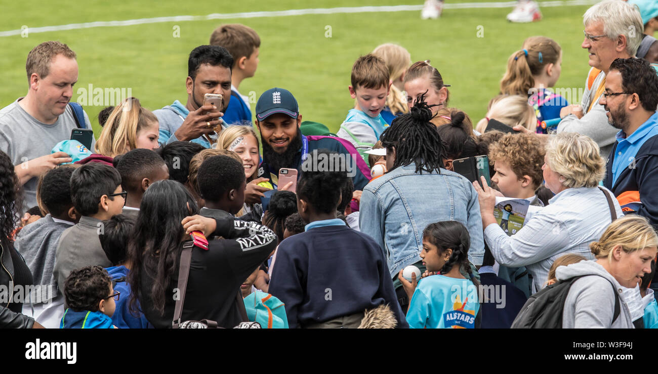 London, UK. 15 July, 2019. Adil Rashid poses for selfies for the crowd ...