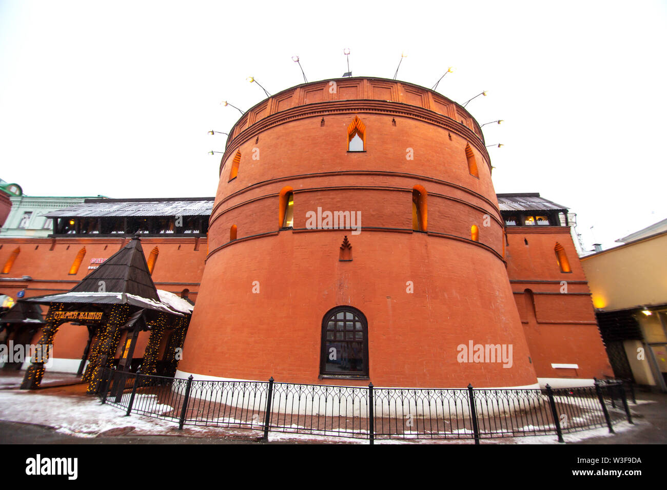 a round red brick building in the style of ancient fortresses, in the ...
