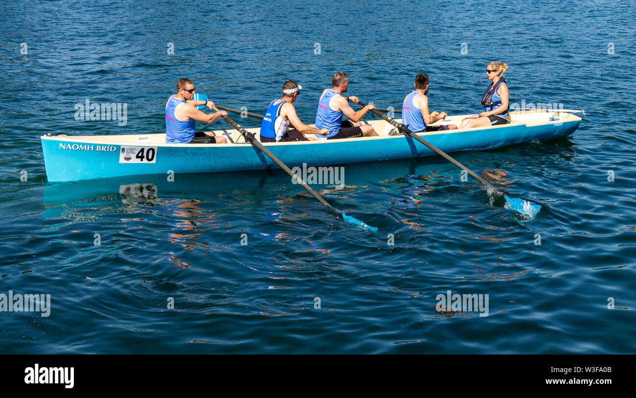 male 4 man crew rowing in an inshore rowing regatta Stock Photo - Alamy