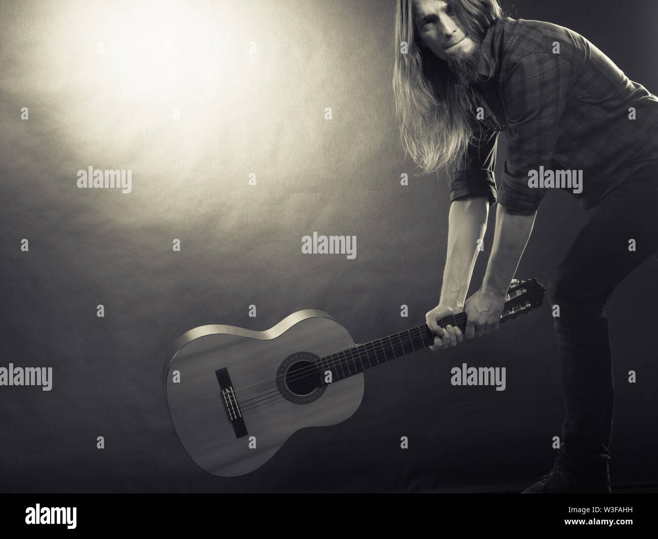 Rock music energy people feelings concept. Mad rock guitarist destroys ...