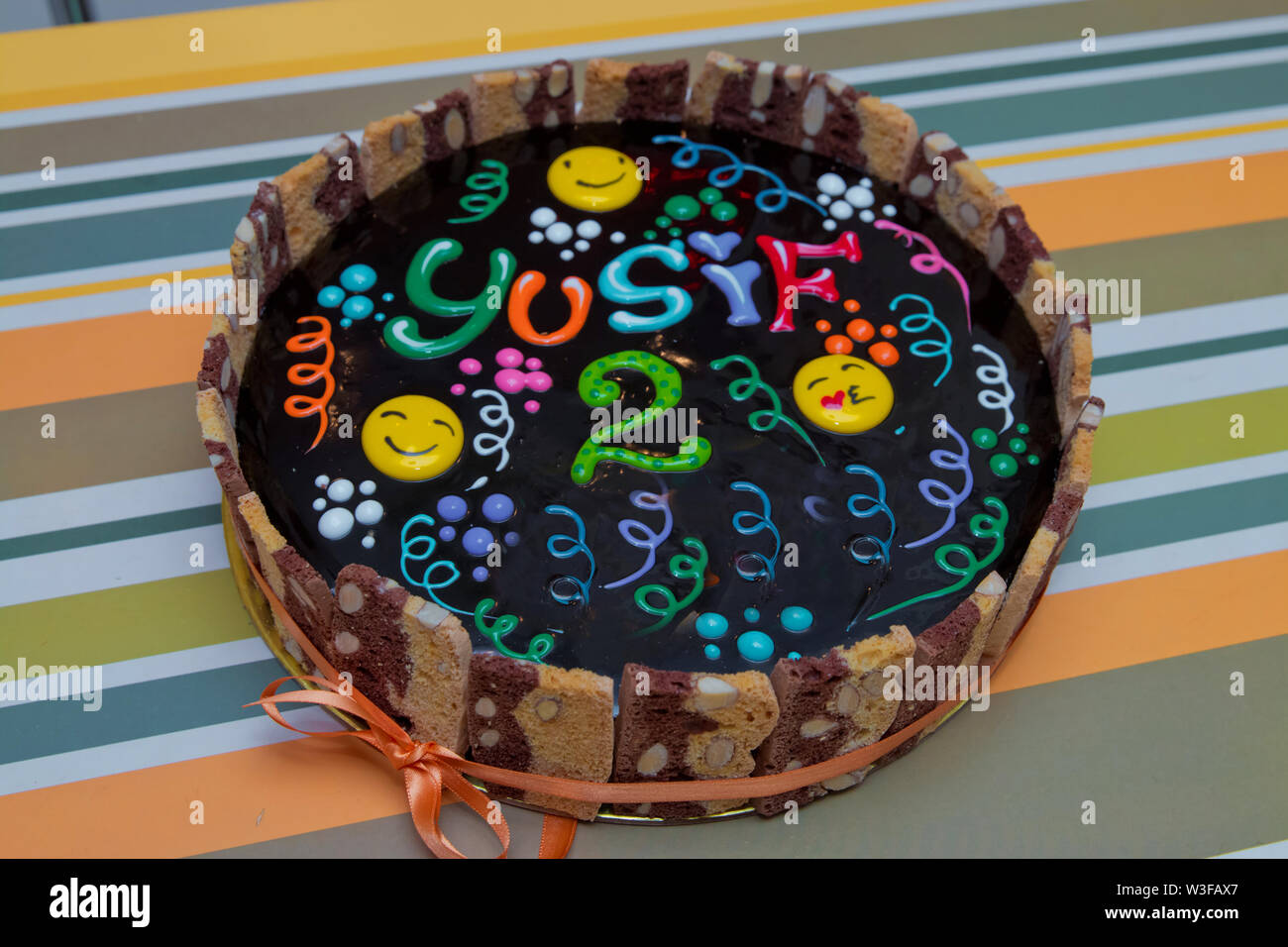 Black cake 2 year old Yusuf writing. Chocolate cake with black glaze ...