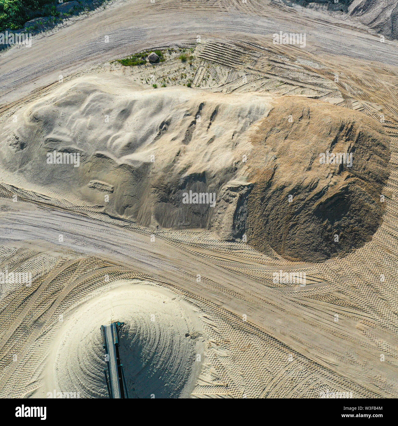 Aerial view of a large heap of sand in a gravel pit and sand pit ...