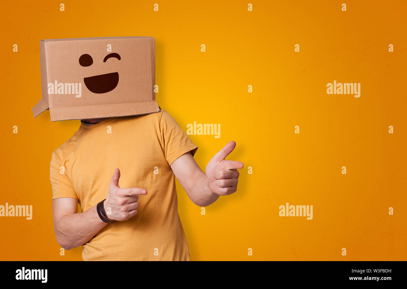 Funny man wearing cardboard box on his head with smiley face Stock ...