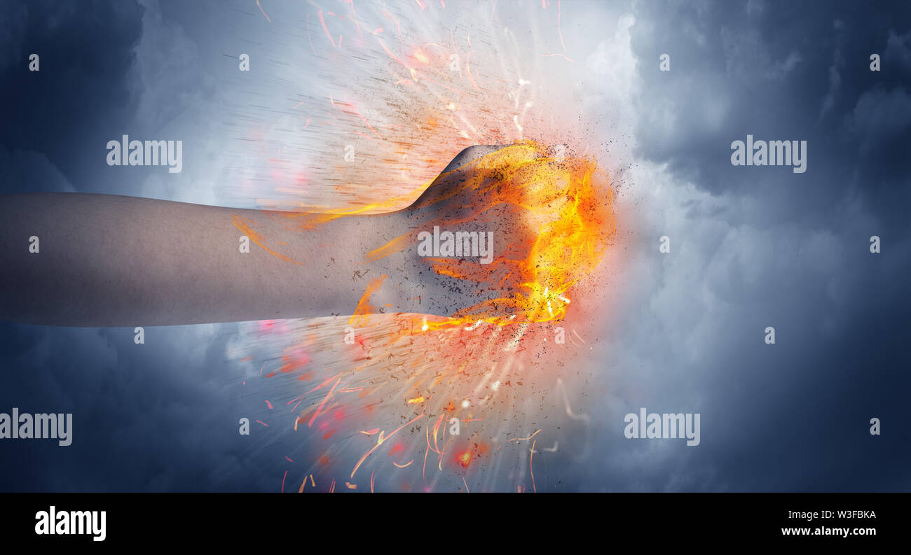 Hand hits strongly and makes fire beam around Stock Photo - Alamy