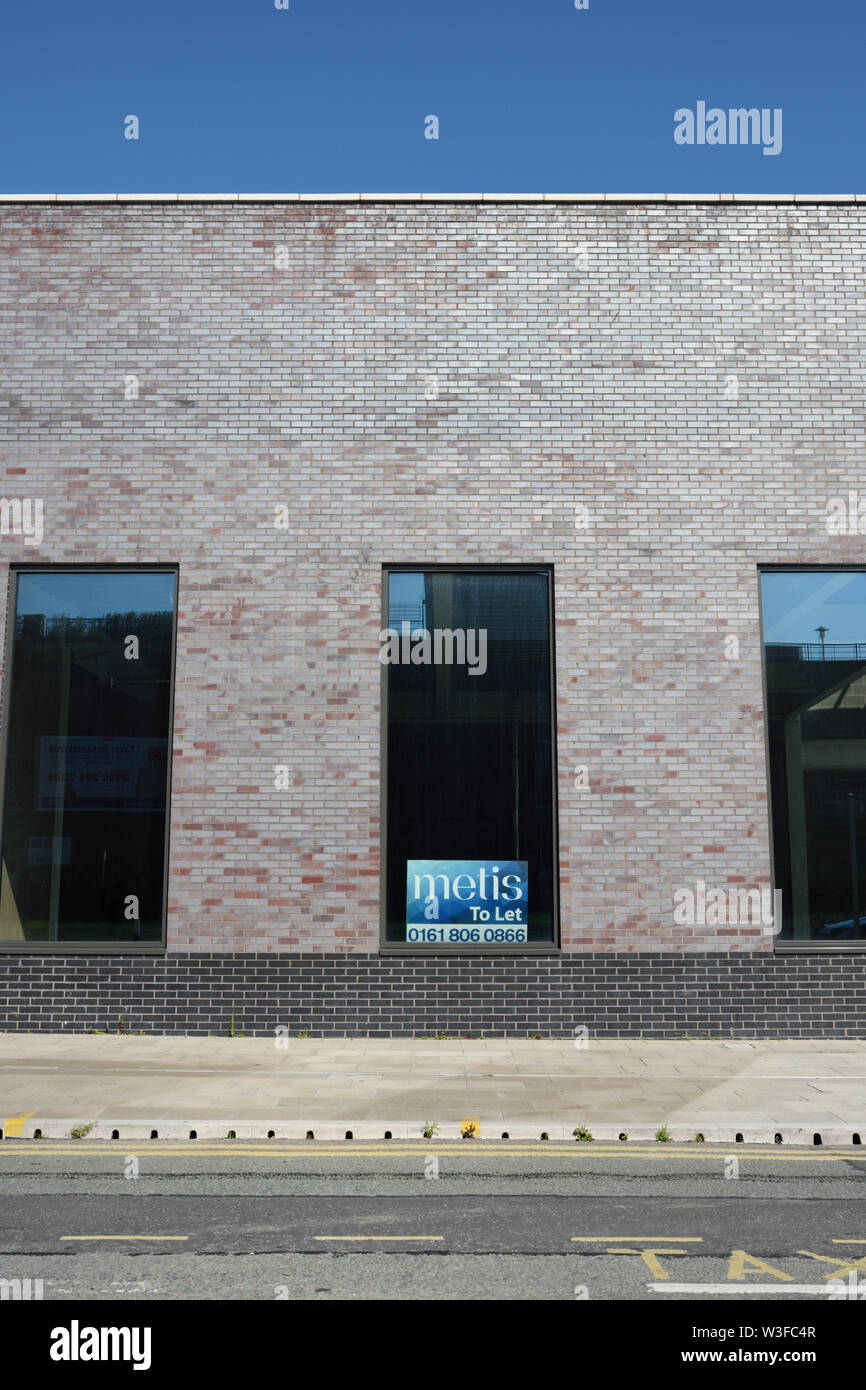 low angle view modern Commercial building with three windows, to let ...