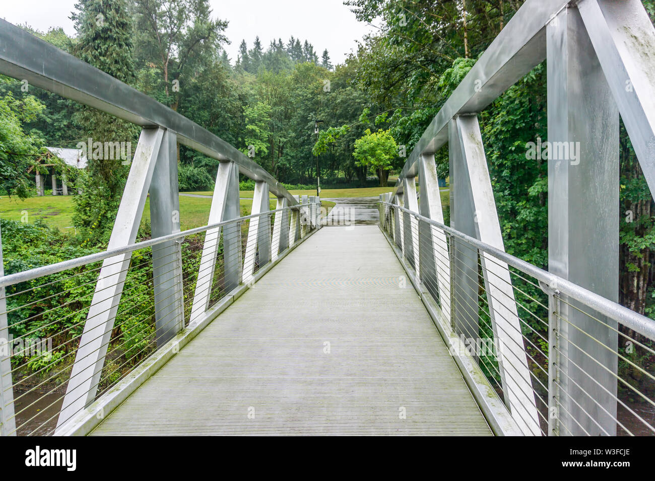 A walking bridge gives access to Maplewood Park in Renton, Washington ...