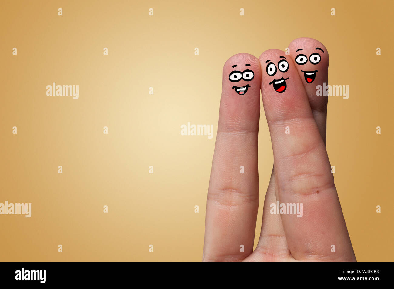 Happy face fingers hug each other Stock Photo - Alamy