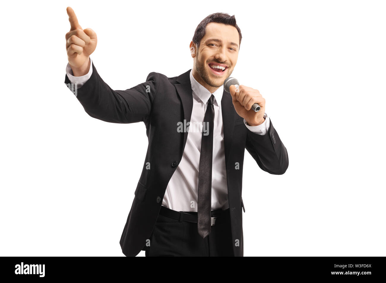 Handsome male singer with a microphone pointing up isolated on white ...