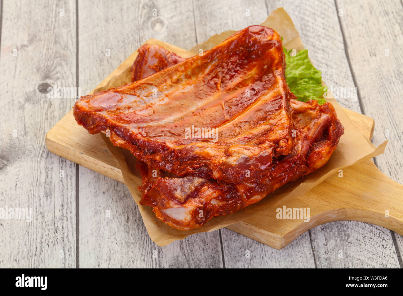 Raw marinated pork ribs ready for cooking Stock Photo - Alamy
