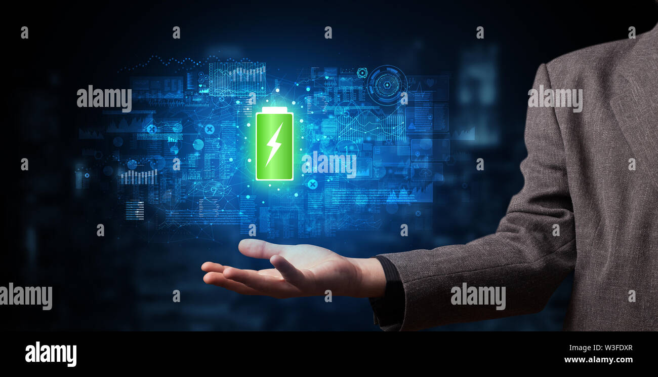 Elegant hand holding battery with full of energy Stock Photo - Alamy
