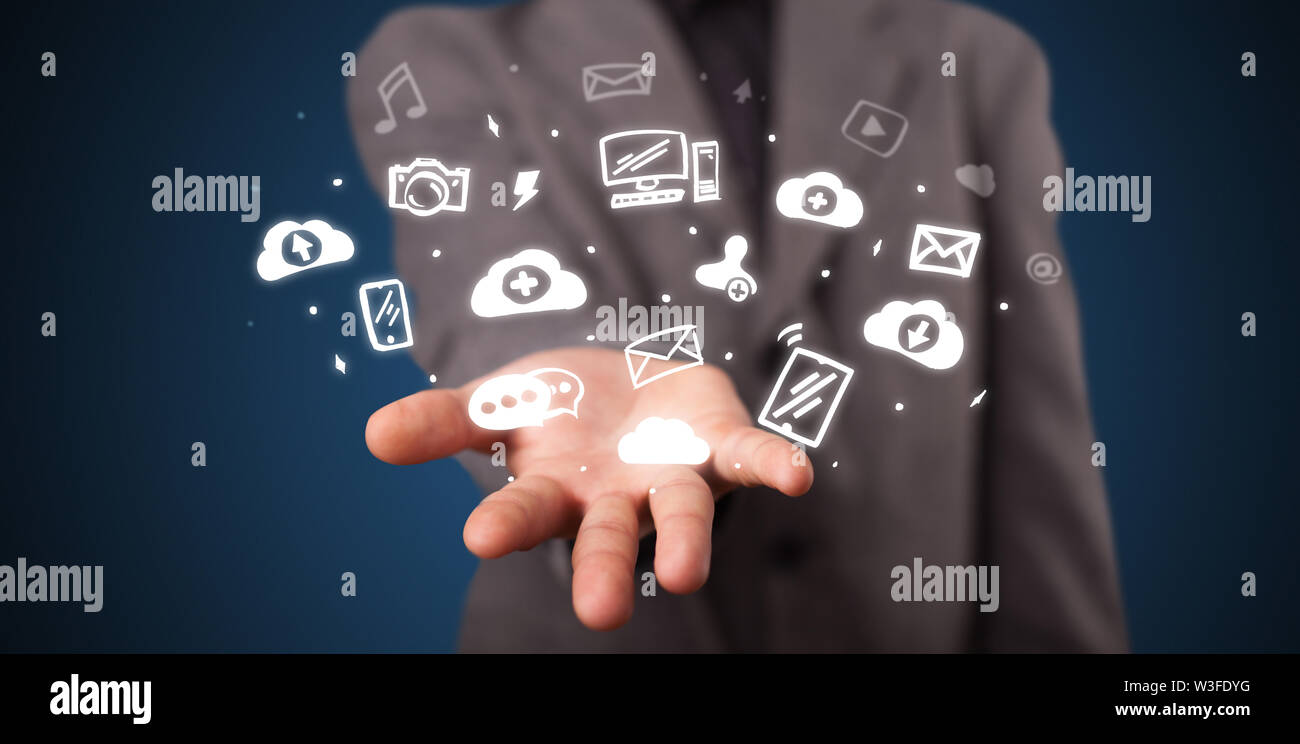 Hand holding application icons and symbols in her hand Stock Photo - Alamy