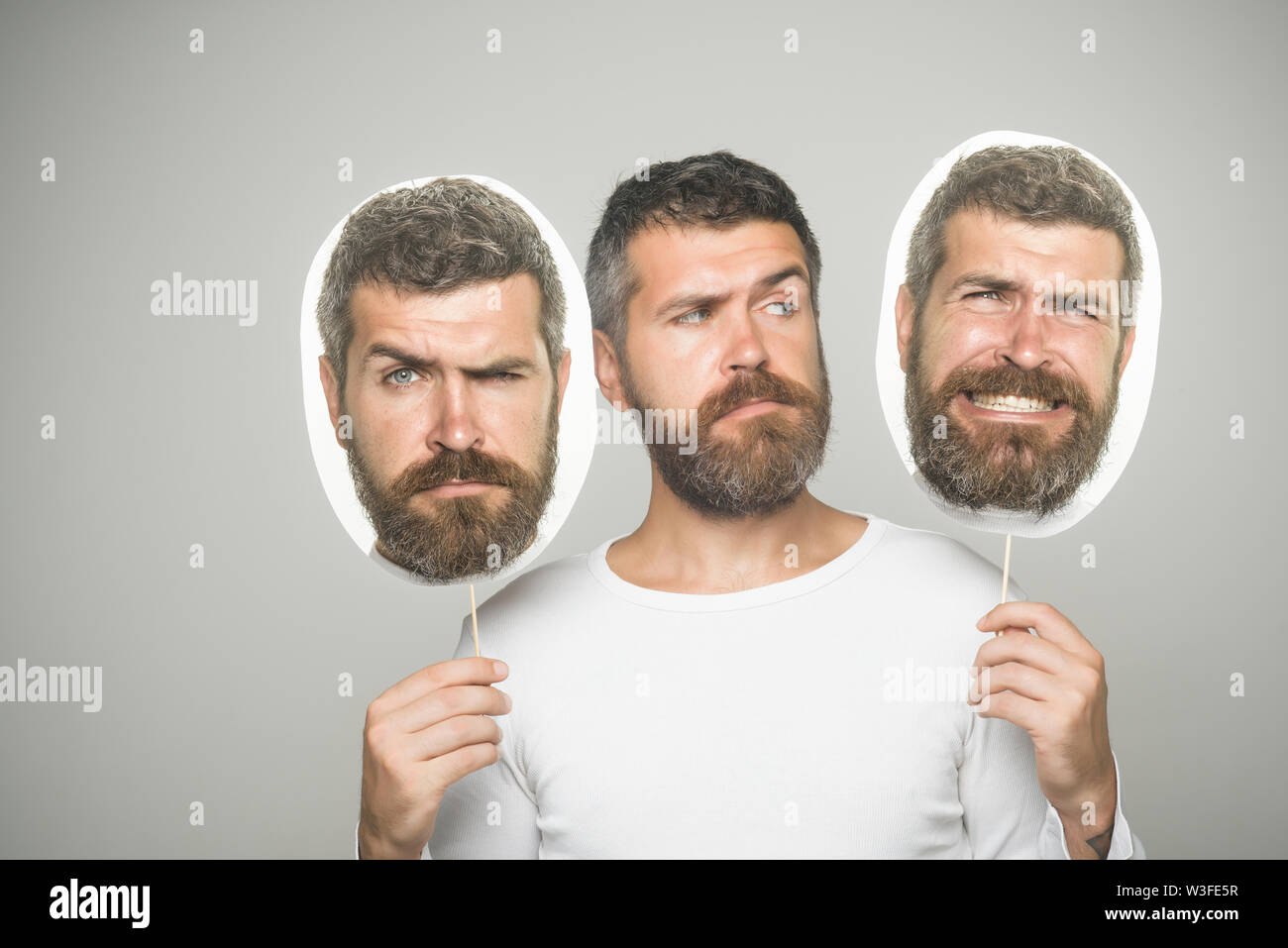 man with long beard on sad face hold paper nameplate Stock Photo - Alamy