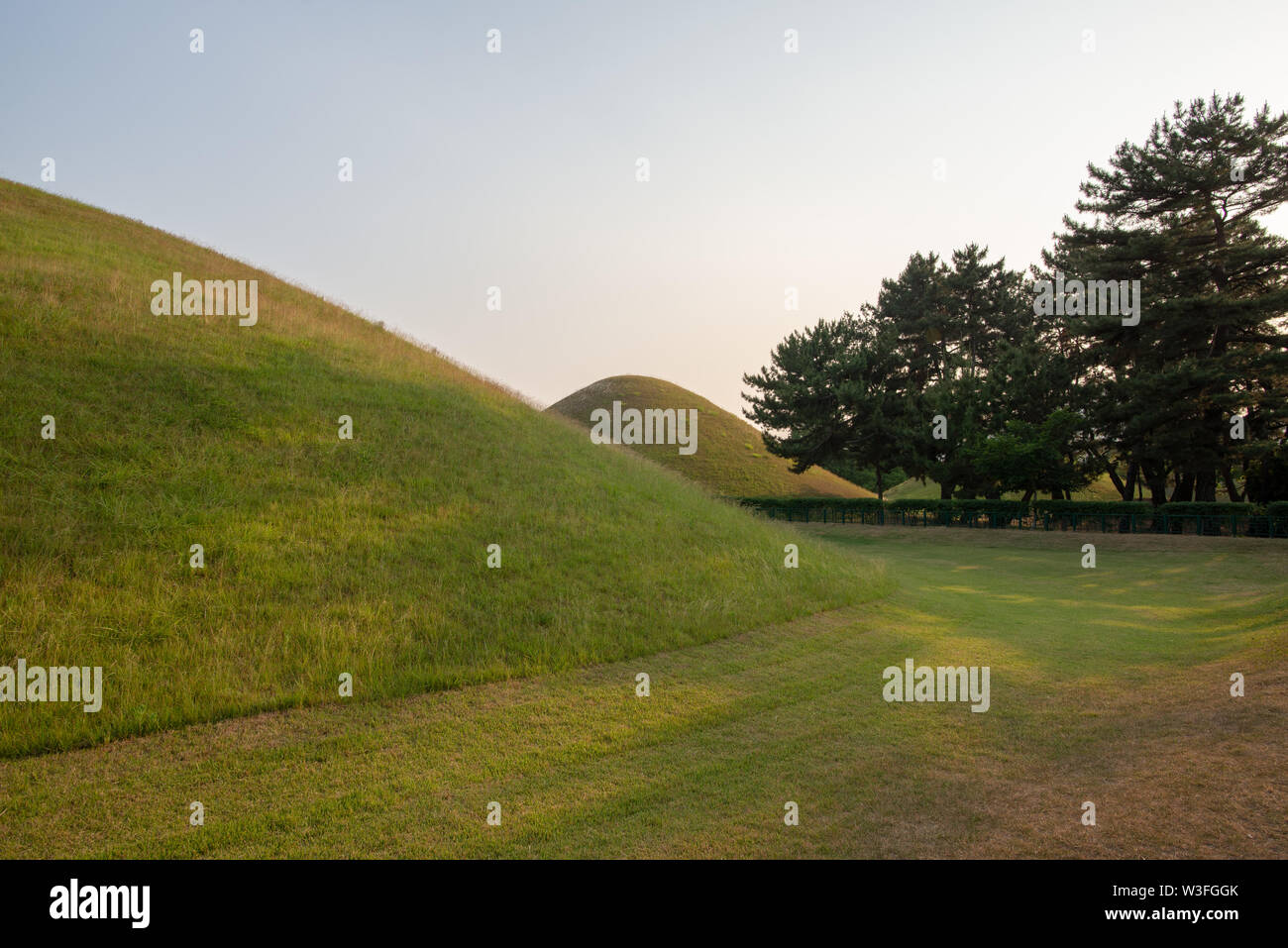 View on two Daereungwon Tombs taken at sunset, Gyeongju, South Korea ...